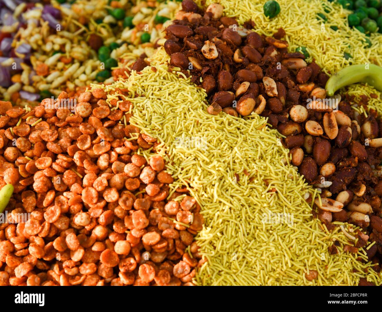 Fresh mix nuts and yellow fresh rice from a food market in India Stock ...
