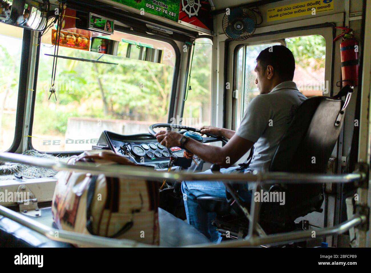 The bus driver is driving in Sri Lanka Stock Photo - Alamy