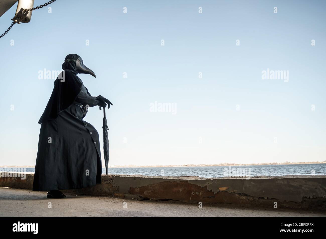 plague doctor in an empty city on an empty marina Stock Photo - Alamy