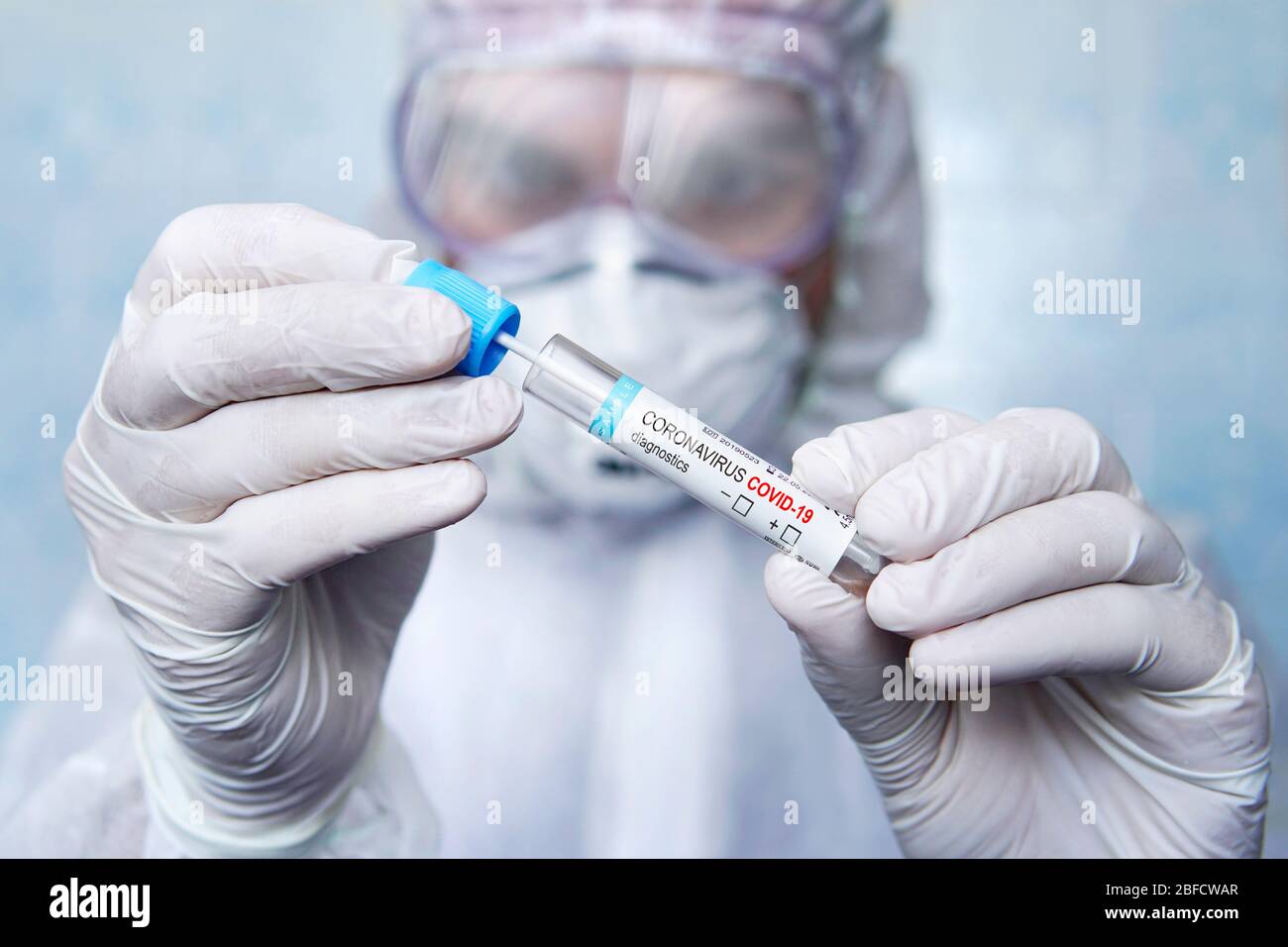 Coronavirus Covid-19 respiratory sputum specimen swab test tube with ...