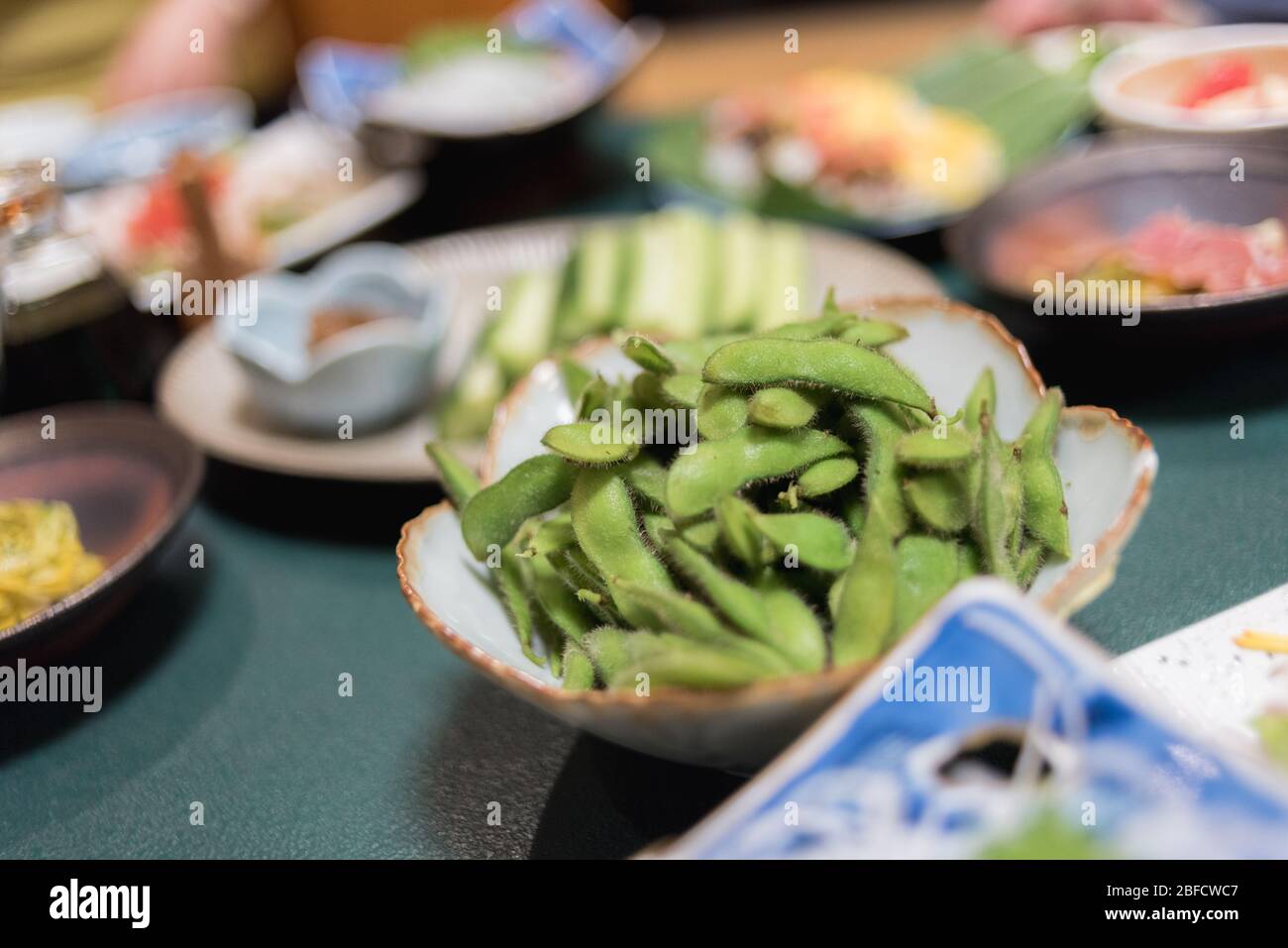 Typical healthy Japanese starter, the green beans boiled and salt, it's ...