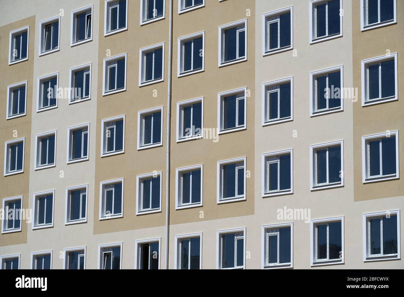 facade of a new multi-storey building with many windows Stock Photo - Alamy