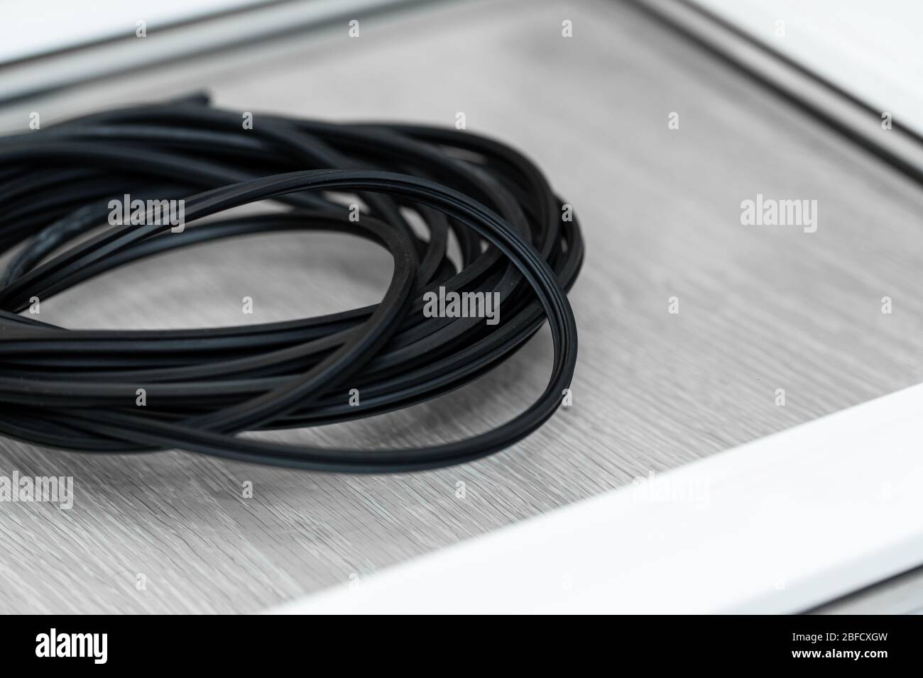 The hank of black rubber seal gasket for pvc windows Stock Photo - Alamy