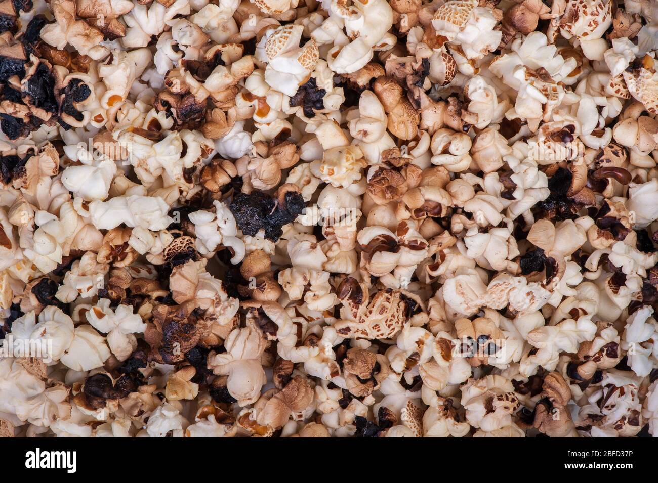 Texture of burnt popcorn background Stock Photo - Alamy