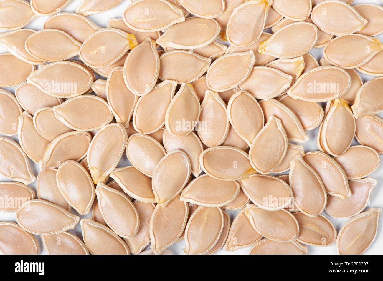 Background full of pumpkin seeds in the shell Stock Photo - Alamy