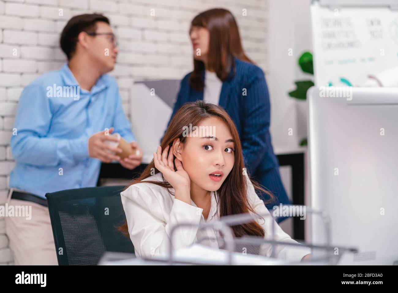 Office talking secret hi-res stock photography and images - Alamy