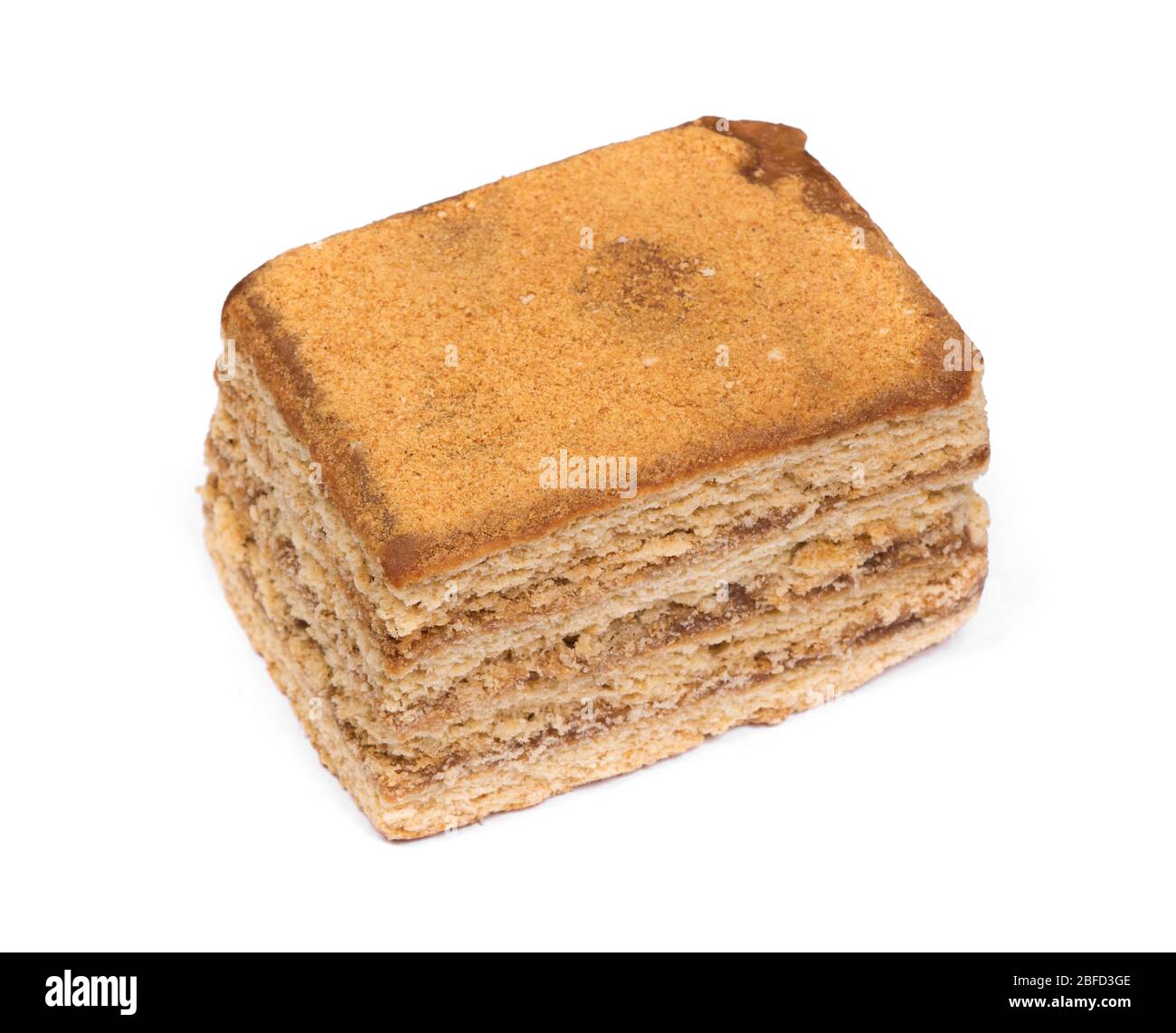 Rectangular piece of classic honey cake isolated on white background ...