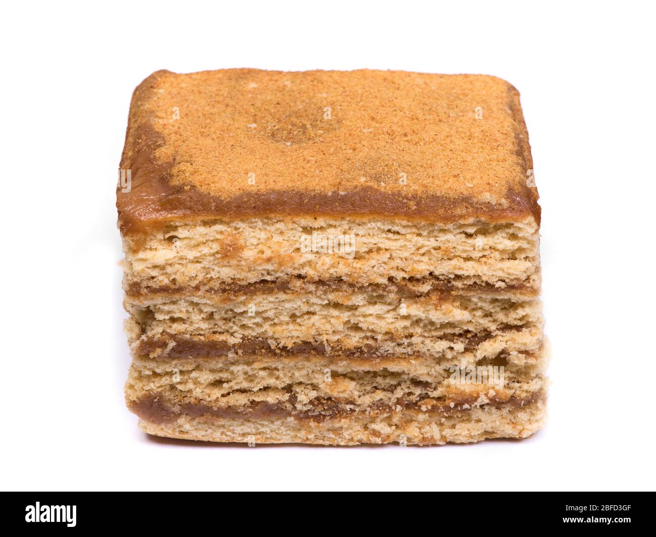 Rectangular piece of classic honey cake isolated on white background ...