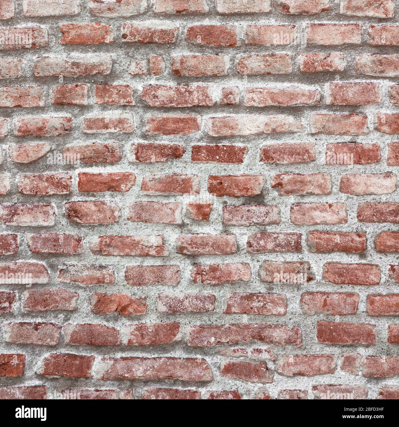 Ancient stone masonry. Fragment of a brick wall of an ancient structure ...