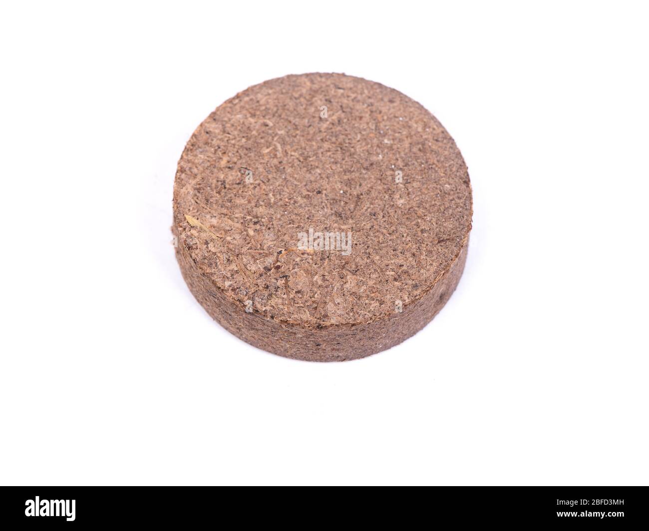 Dry peat pellets, compressed compost tablet isolated over the white ...