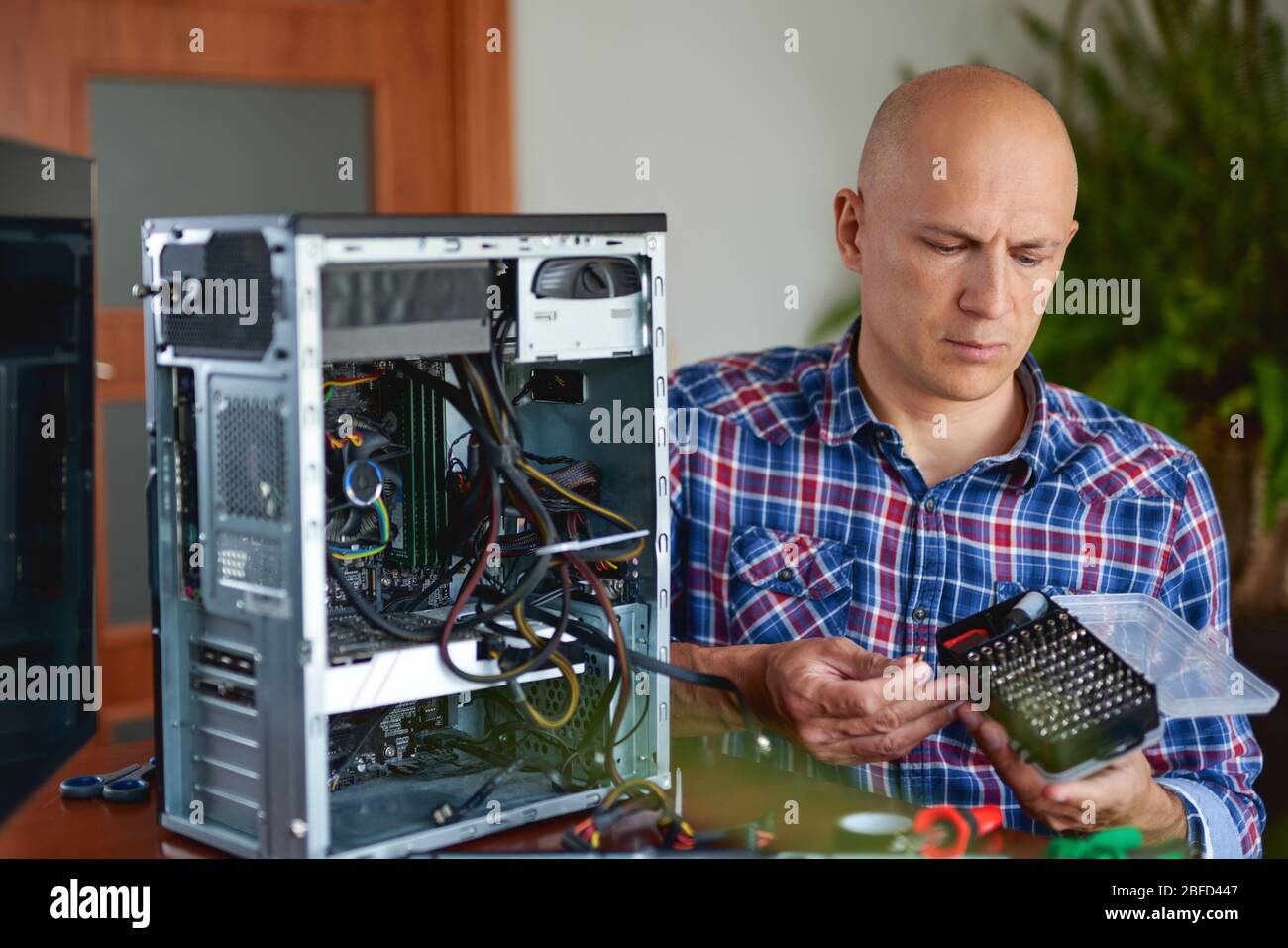 Computer repair. Computer technician working on a personal computer ...