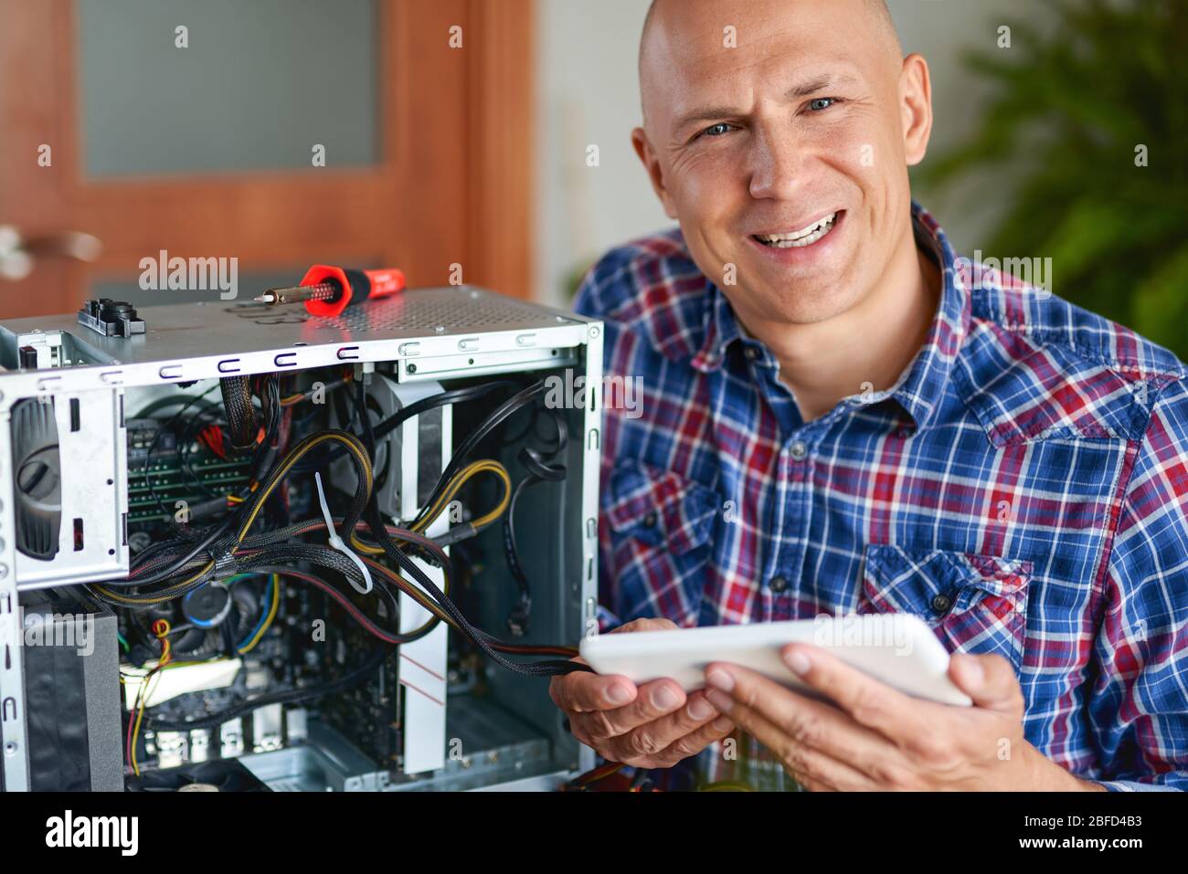 Computer repair. Computer technician working on a personal computer ...