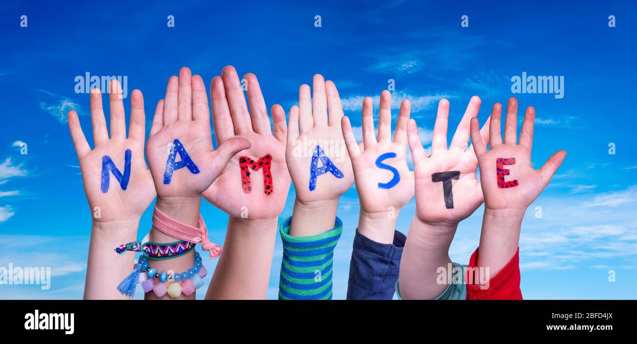 Children Hands Building Word Namaste Means Hello, Blue Sky Stock Photo ...
