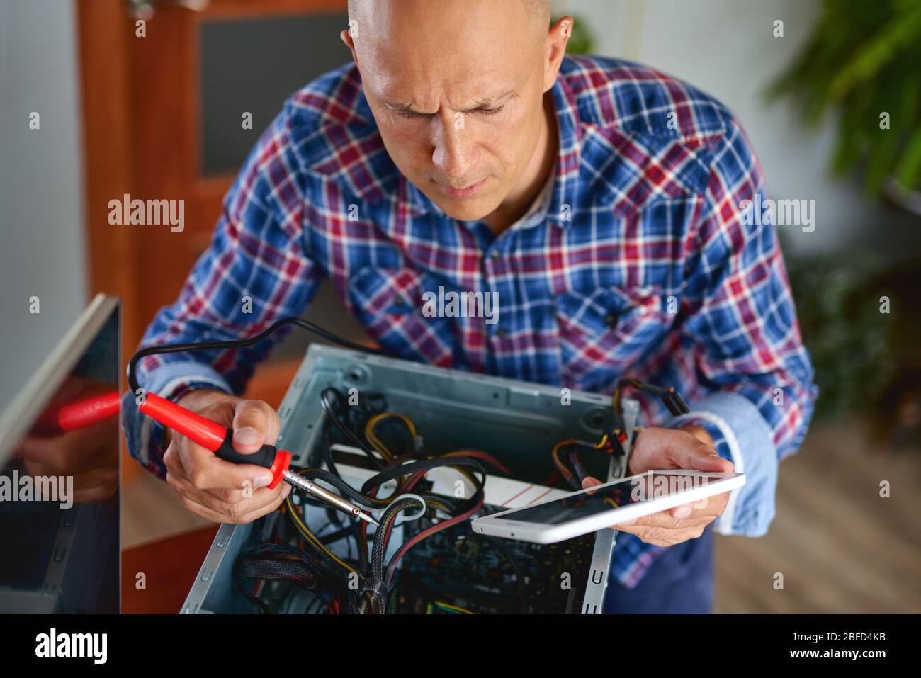 Computer repair. Computer technician working on a personal computer ...