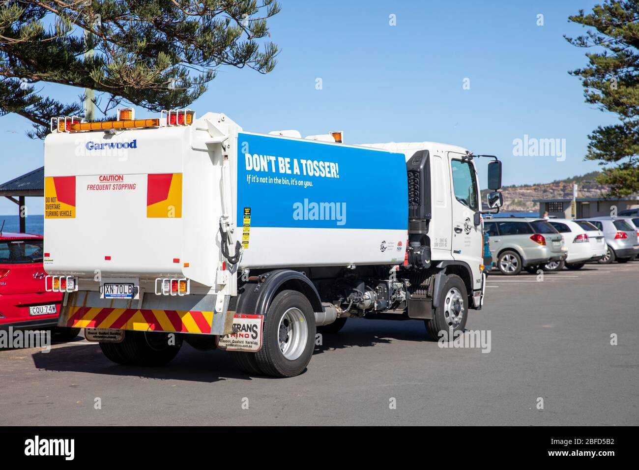 Council waste collection truck in Sydney picking up and emptying public ...