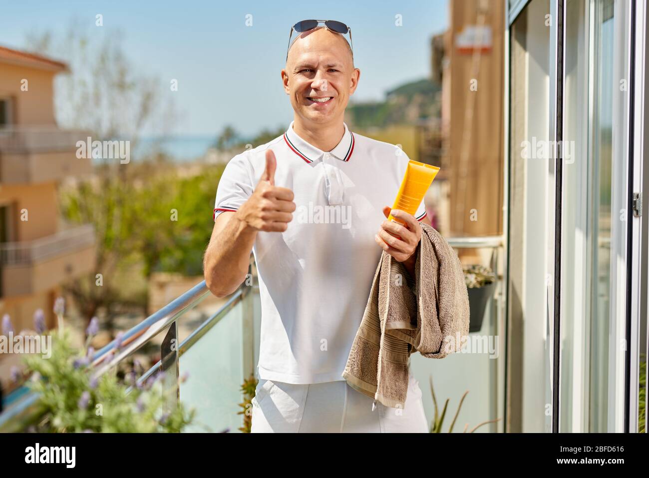 Man on the hotel terrace near the seashore. Vacation at the resort ...