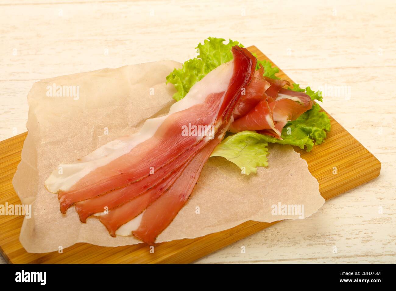 Spanish Hamon meat served salad leaves Stock Photo - Alamy