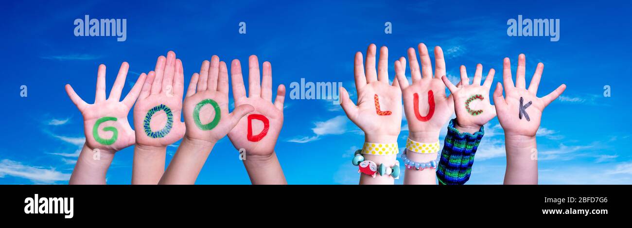 Kids Hands Holding Word Good Luck, Blue Sky Stock Photo - Alamy