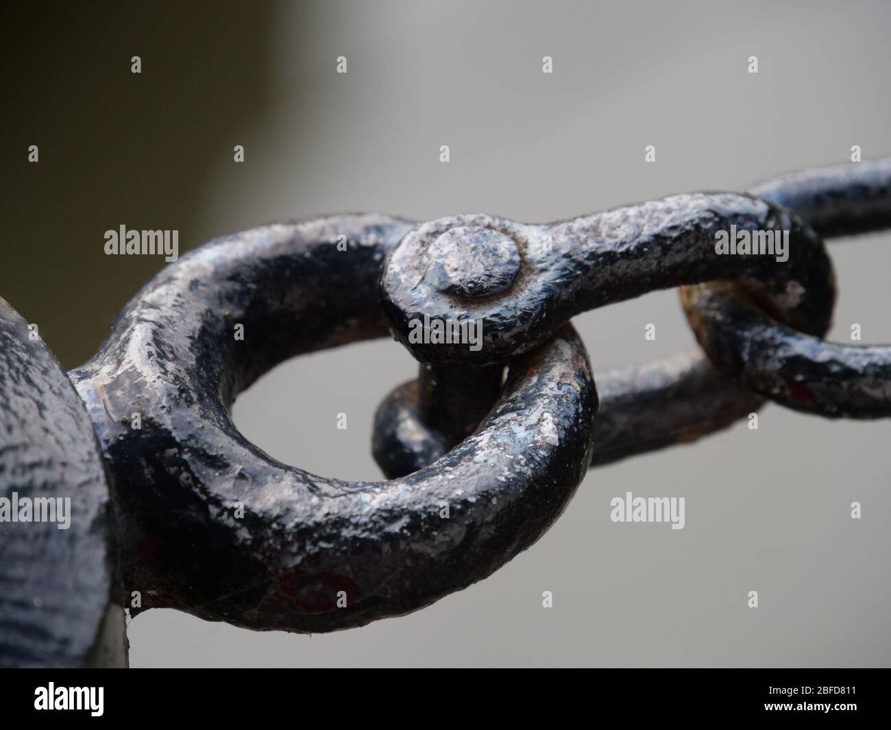 Black metal eyelet in which a shackle is fastened Stock Photo - Alamy