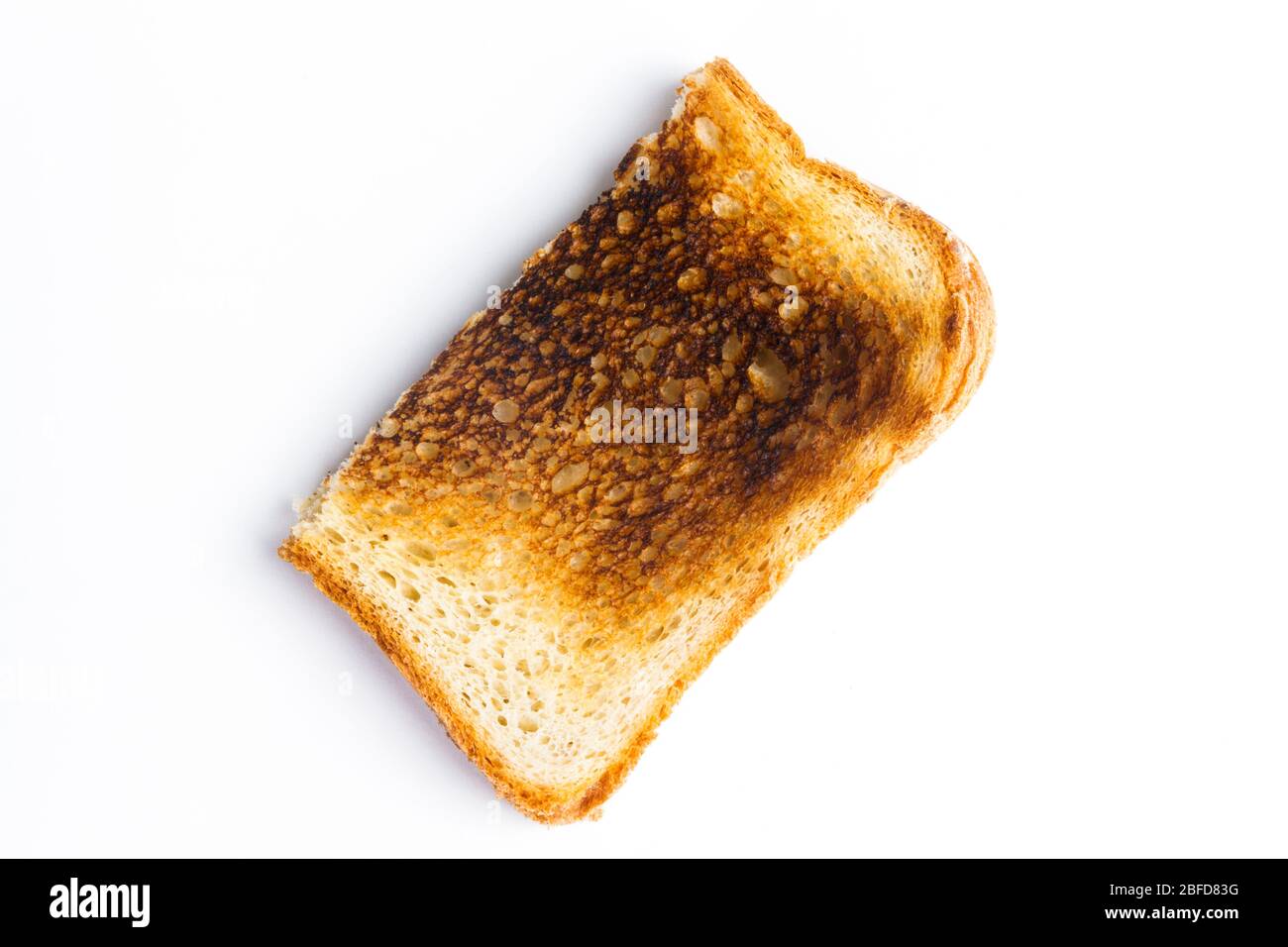 Slice of burnt toast Stock Photo - Alamy