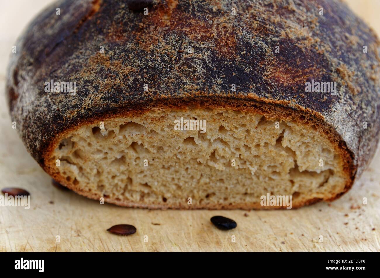 The end of the freshly baked loaf of bread has been sliced off ...
