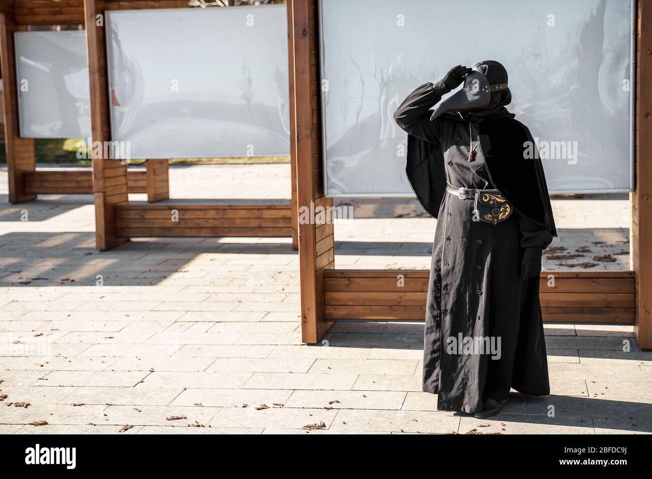 plague doctor stands at empty stands Stock Photo - Alamy