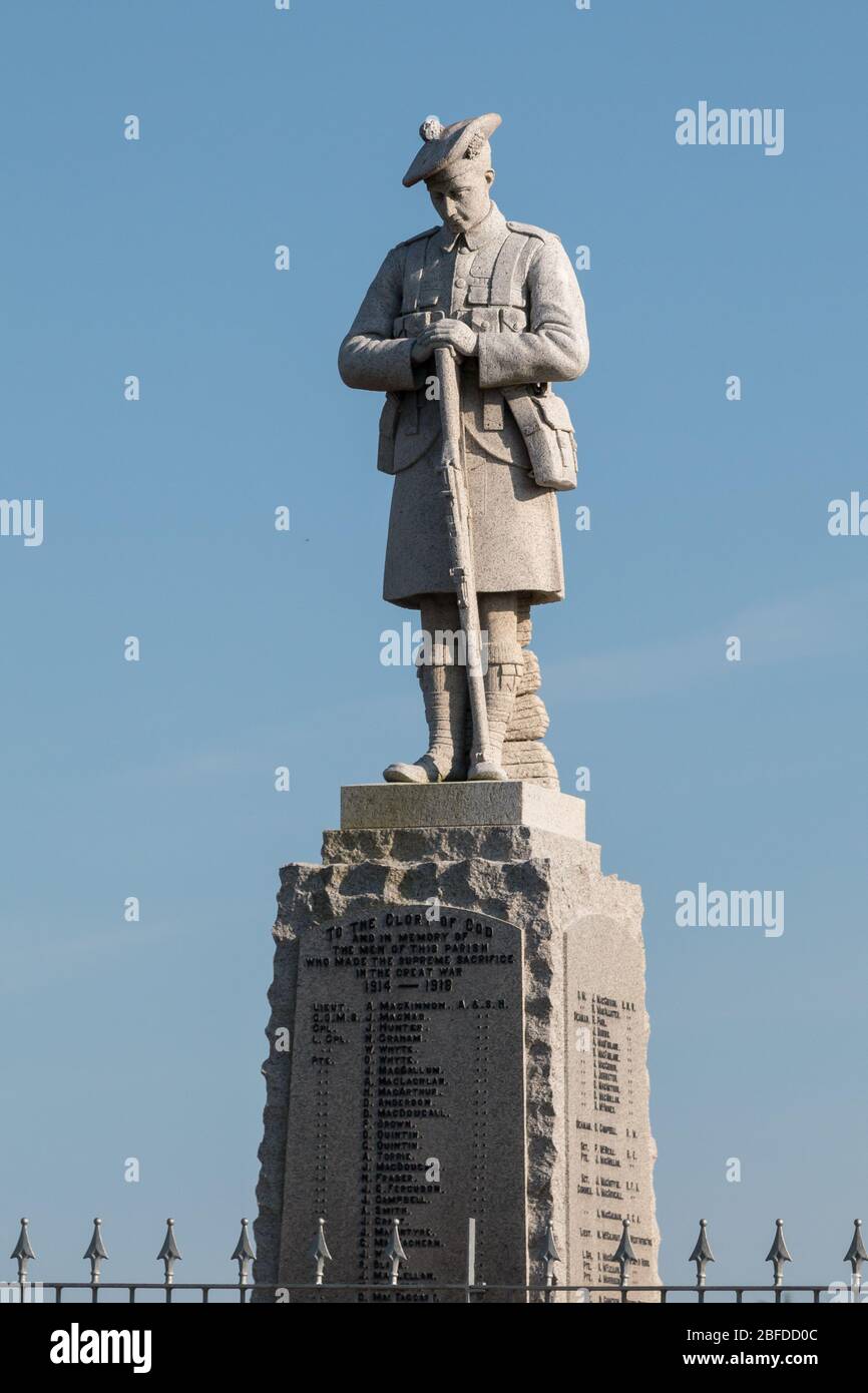Statue of a soldier, war memorial in Port Ellen, a picturesque little ...