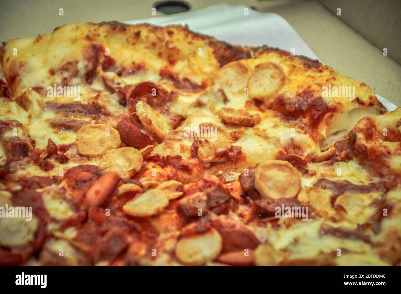 A Pan of pizza full with meat and cheese topping Stock Photo - Alamy