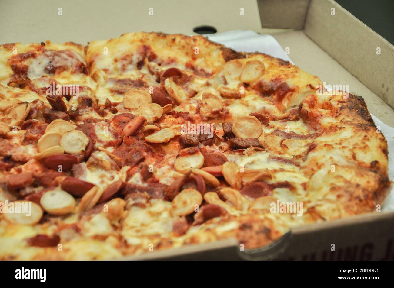 A Pan of pizza full with meat and cheese topping Stock Photo - Alamy