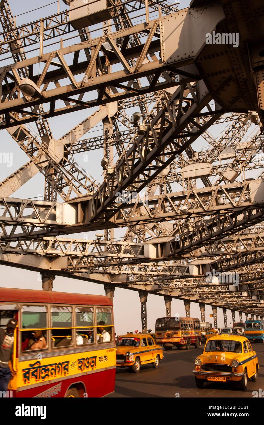 public transport passes under the historic howrah bridge, over the ...