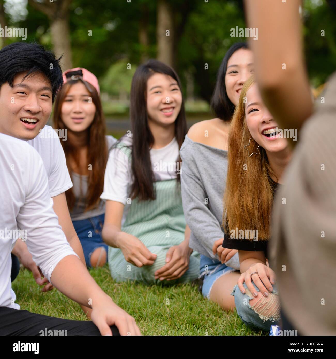 Happy young group of friends having fun together at the park Stock ...