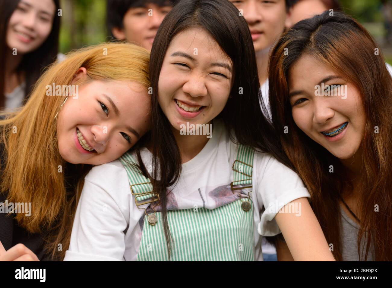 Happy young group of friends having fun together at the park Stock ...
