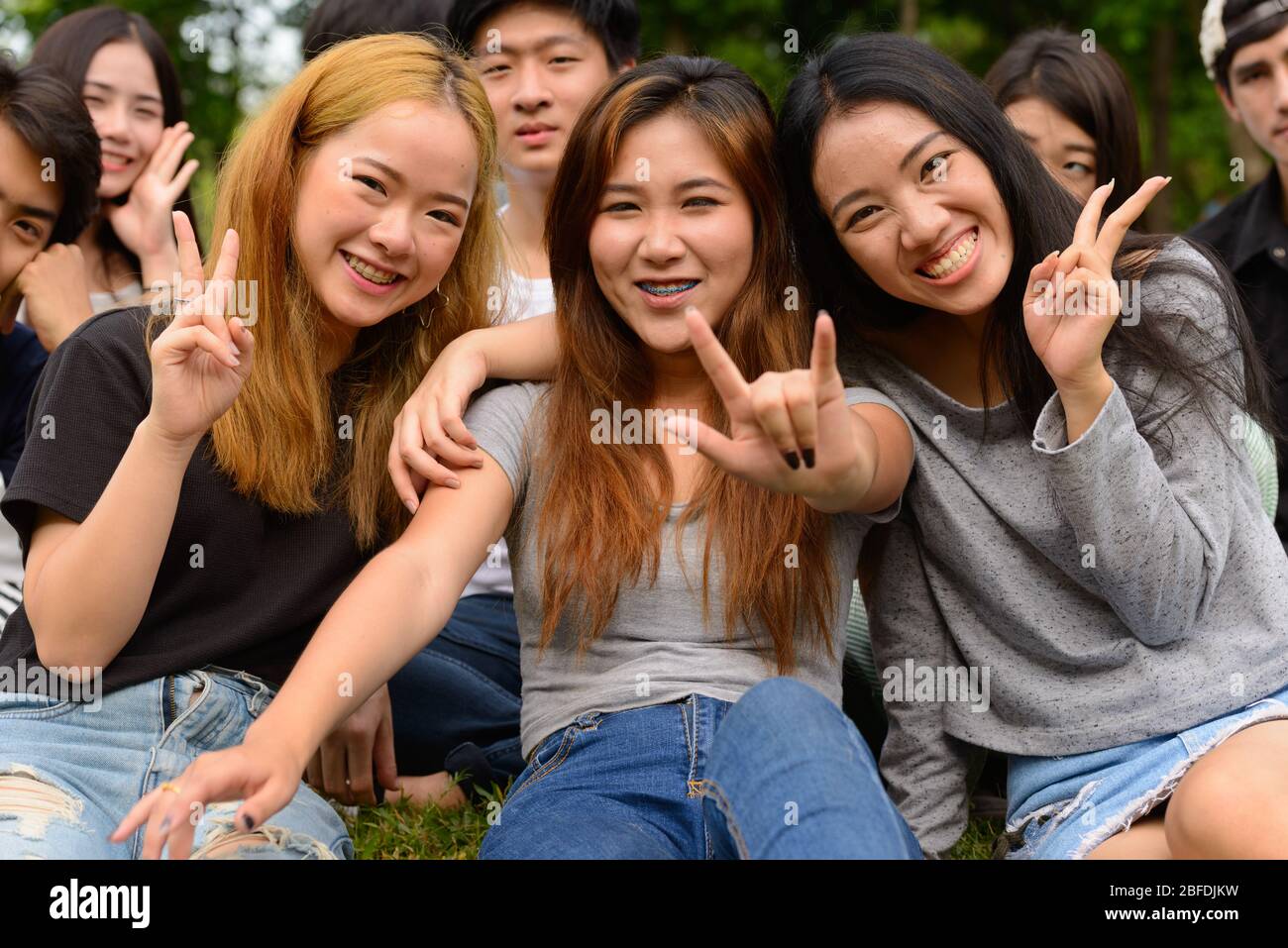 Happy young group of friends having fun together at the park Stock ...