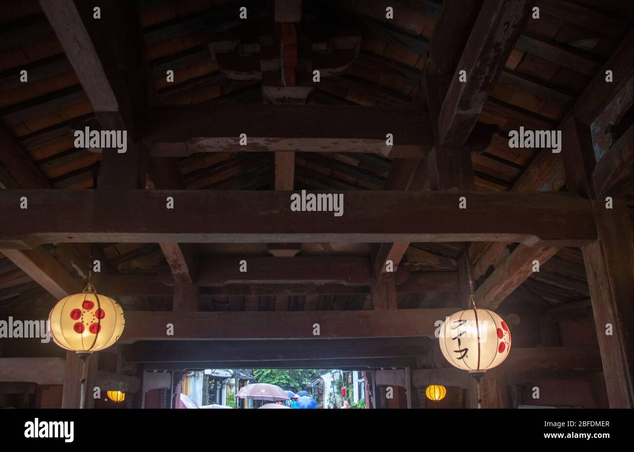 Traditional hand painted silk lanterns hanging from the covered ...