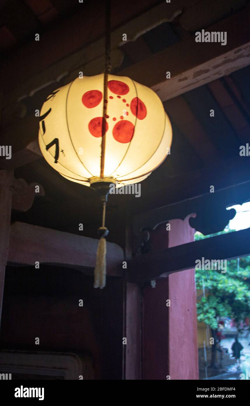 Traditional hand painted silk lanterns hanging from the covered ...