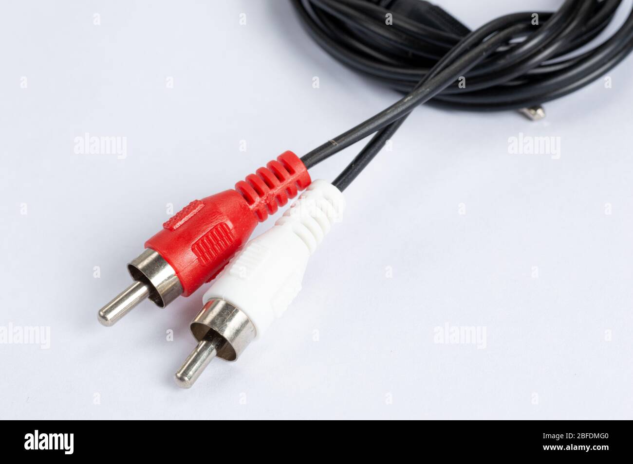 One audio cable close-up against a white background Stock Photo - Alamy