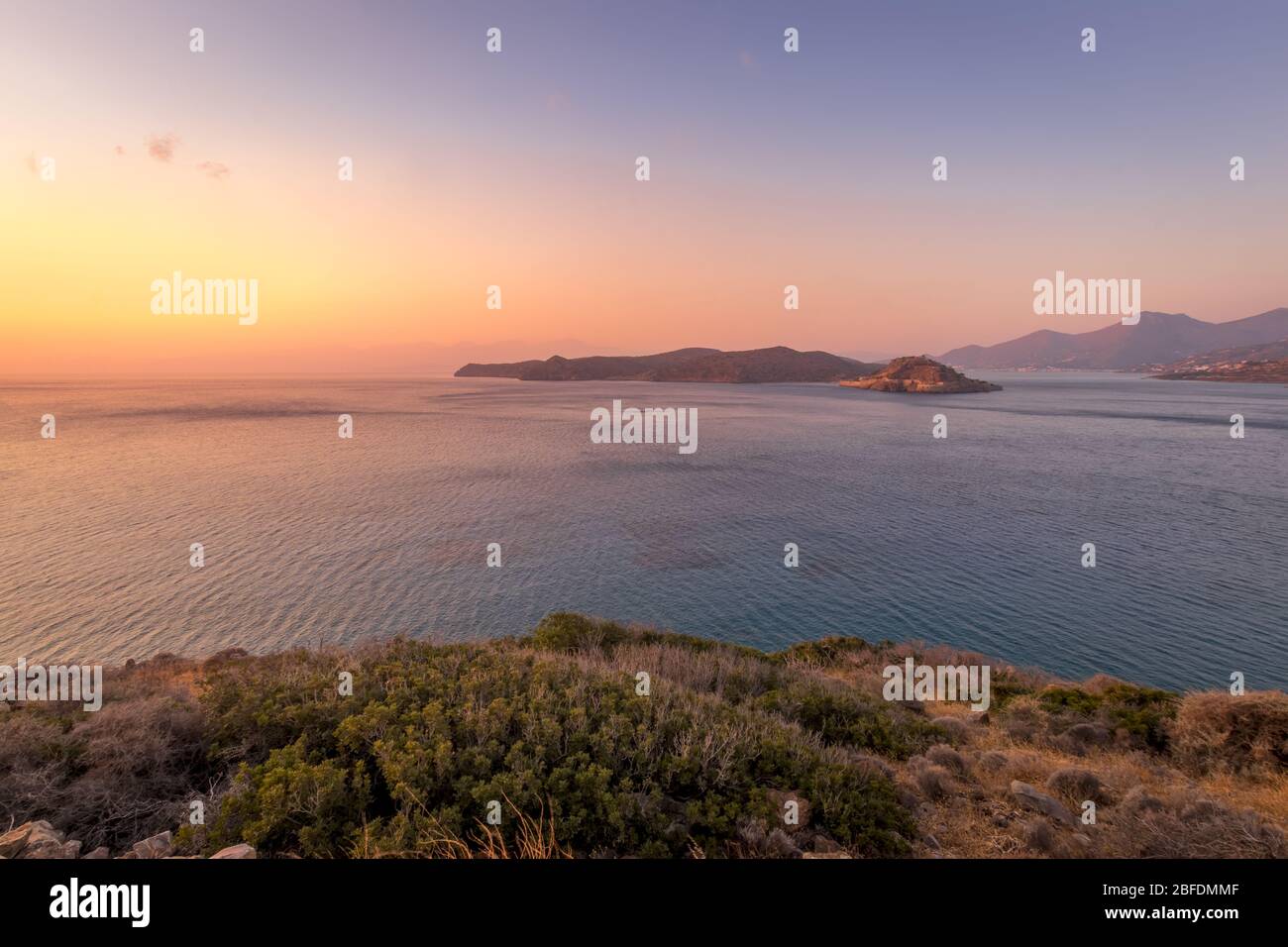 Sunrise on the island of Crete with view to Spinalonga, sea coast ...
