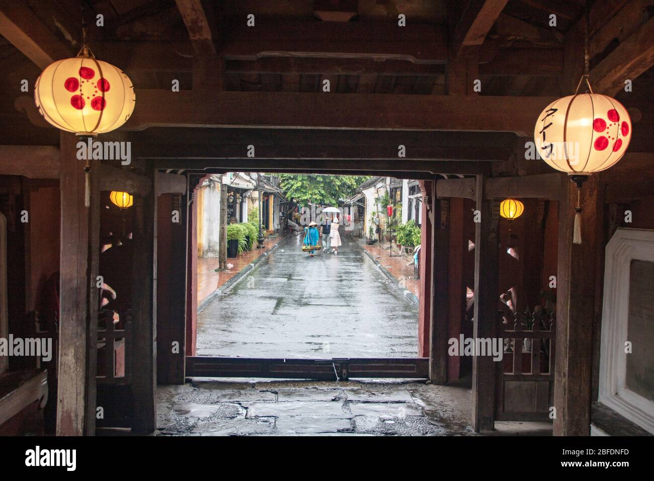 Traditional hand painted silk lanterns hanging from the covered ...