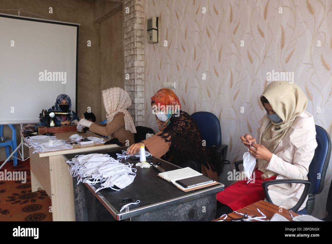 Sari Pul, Afghanistan. 13th Apr, 2020. Afghan women make facemasks at a ...