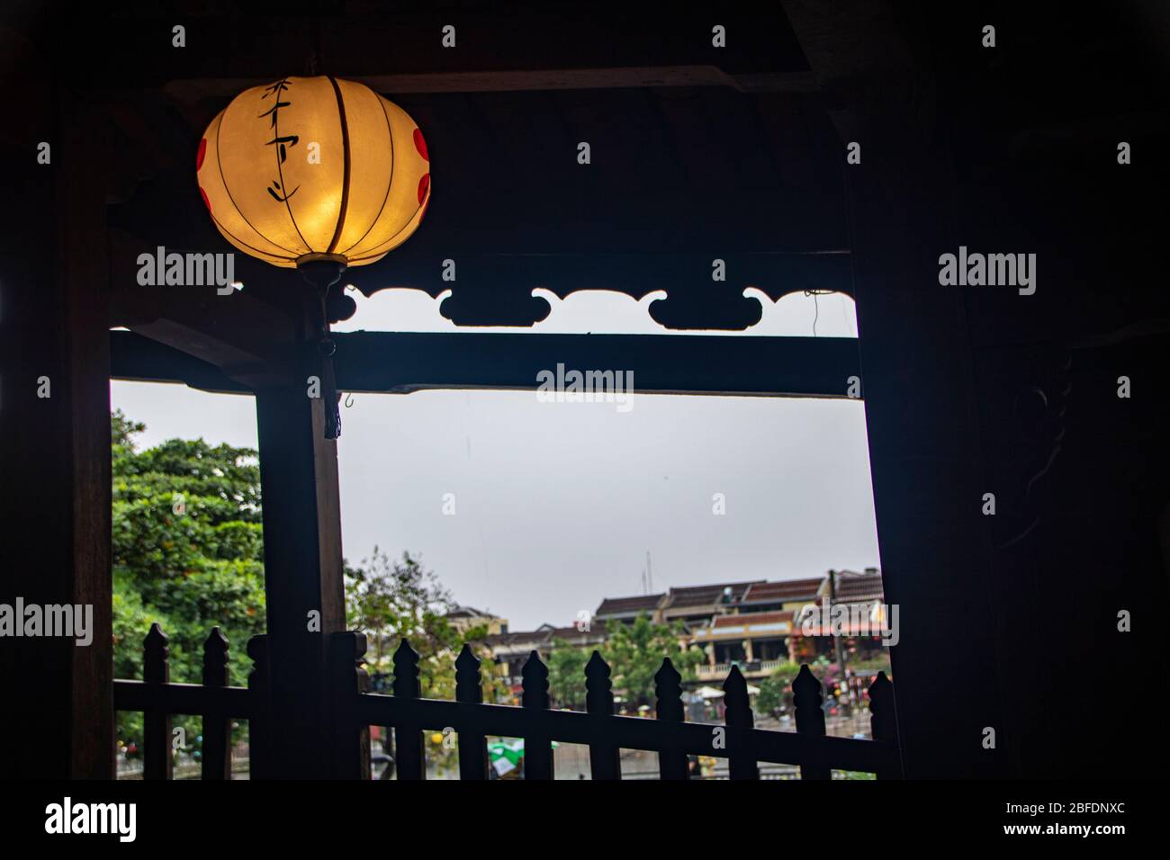 Traditional hand painted silk lanterns hanging from the covered ...