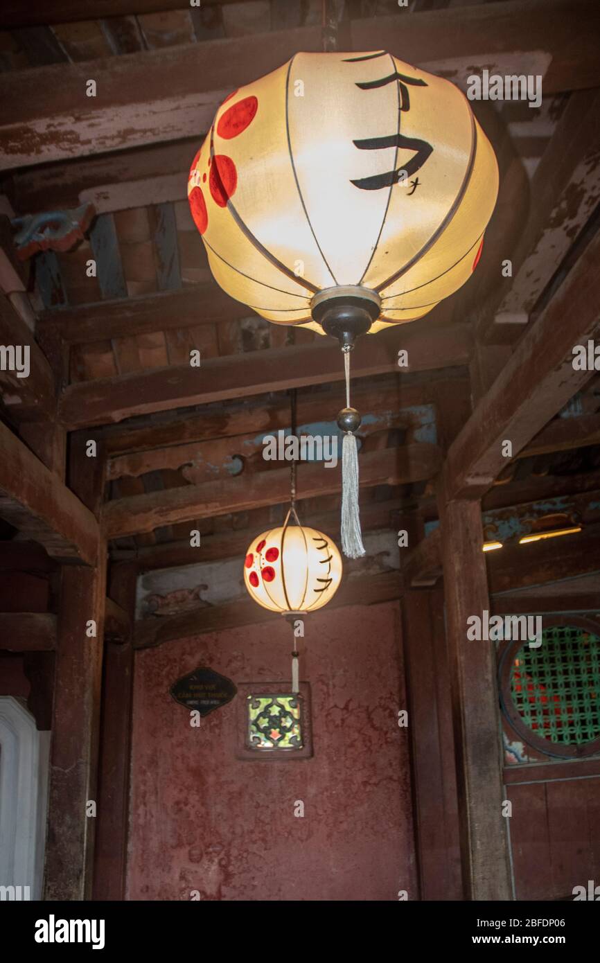 Traditional hand painted silk lanterns hanging from the covered ...