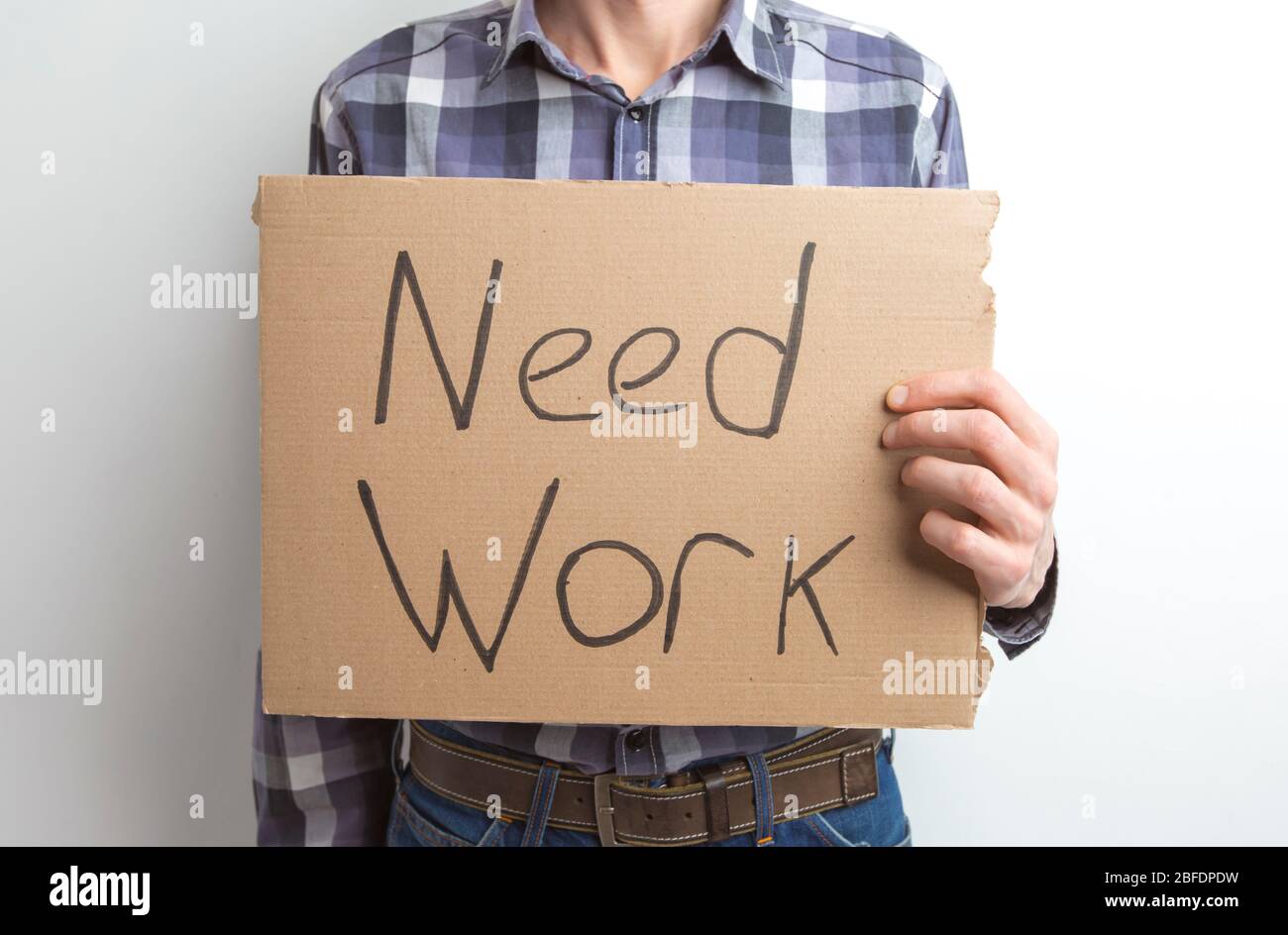 Need work, the inscription in the hands of the employee. The concept of ...