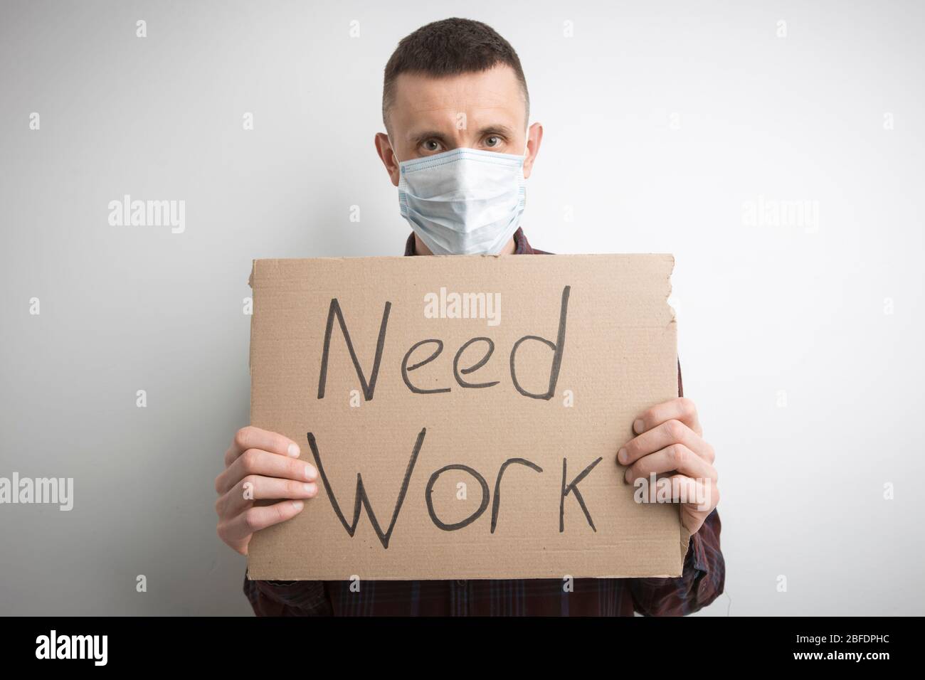 Need work, the inscription in the hands of the employee. The concept of ...