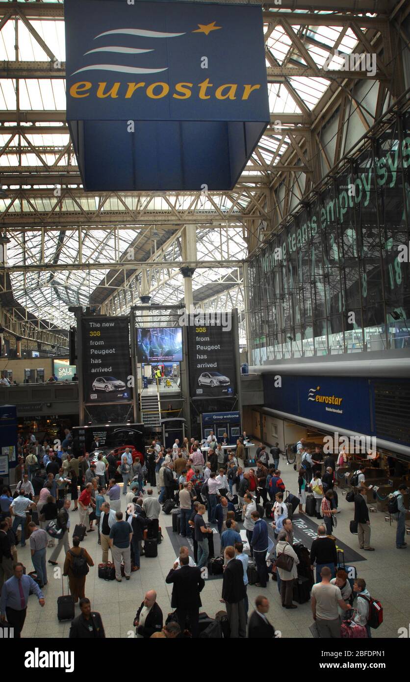 Commuters wait for their train in the old International Eurostar ...