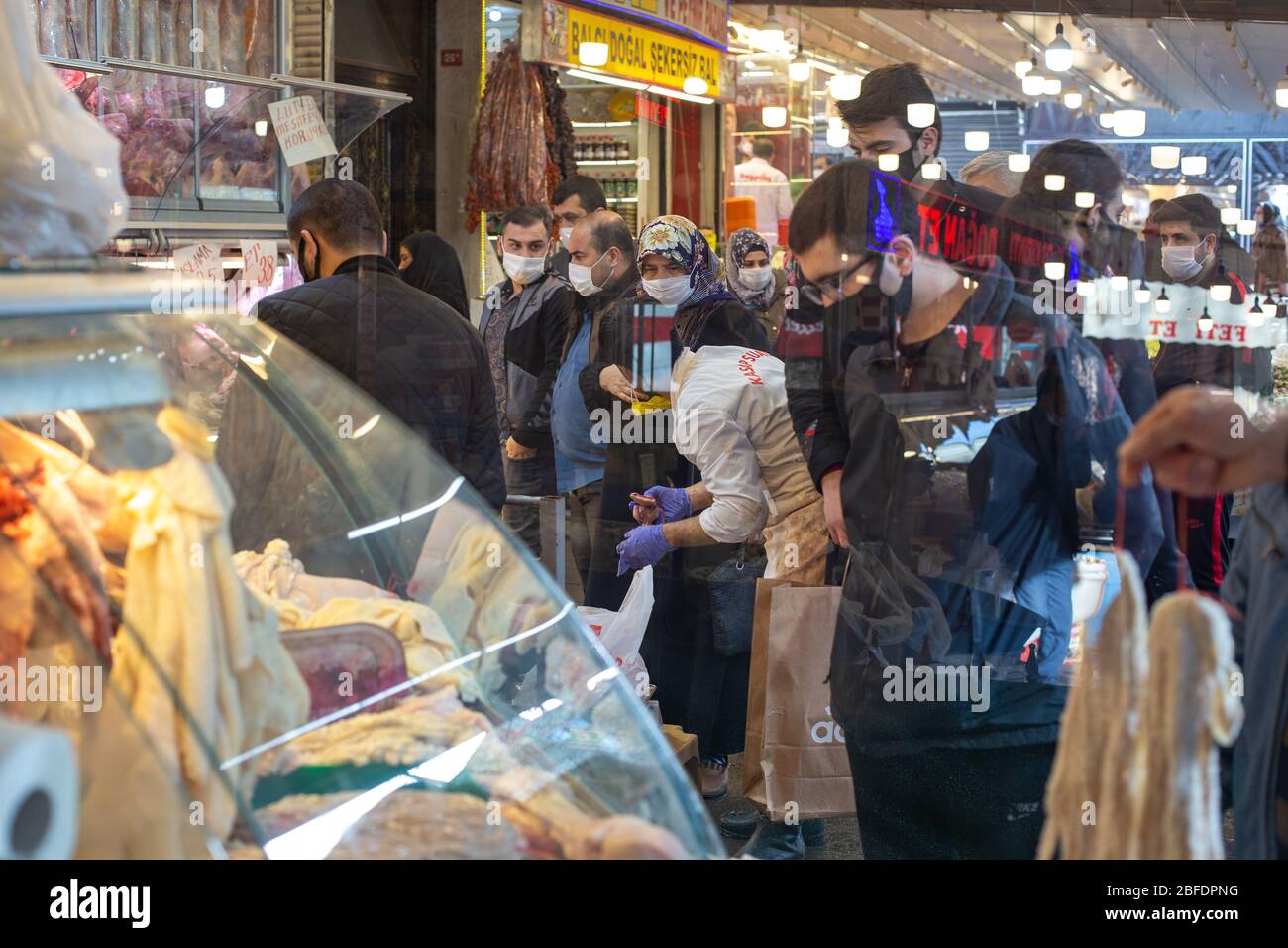 People shopping in the famous Fatih Women's Market, mainly meat and ...
