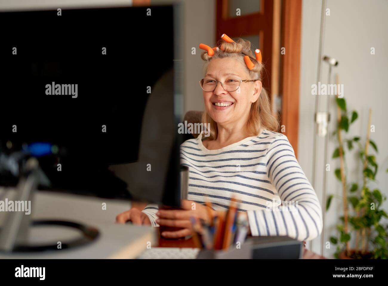 Woman resting looking at the monitor screen Stock Photo - Alamy