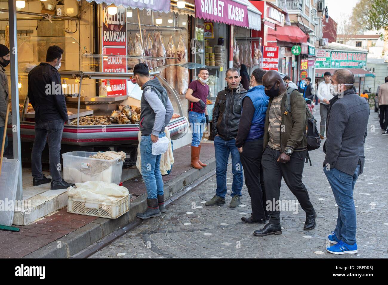 People shopping in the famous Fatih Women's Market, mainly meat and ...