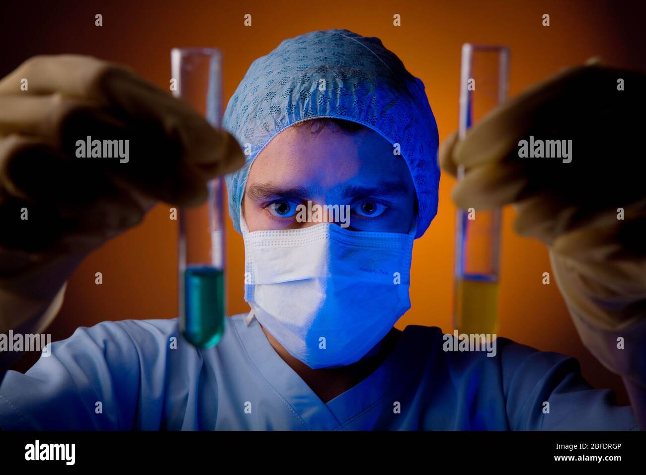 Hand holding two test tubes hi-res stock photography and images - Alamy