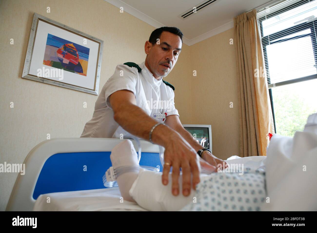 A doctor checks up on his patient following an operation Stock Photo ...