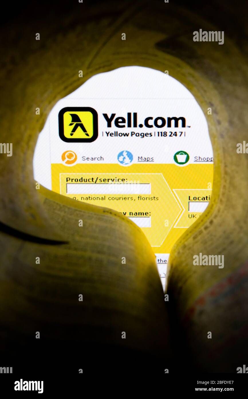 A Yellow Pages in front of a computer screen with Yellow Pages' online ...